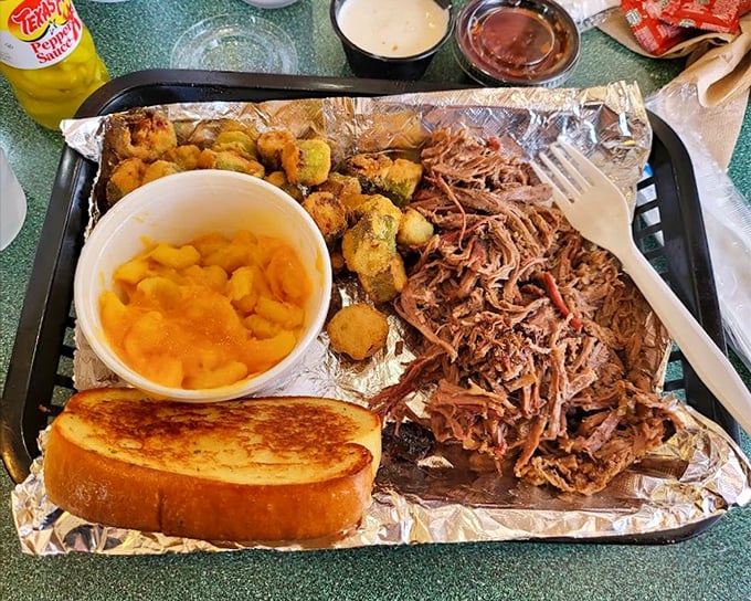 A barbecue tray that answers life's most important question: "Why choose one side when you can have three?" The pulled pork is the undisputed star.