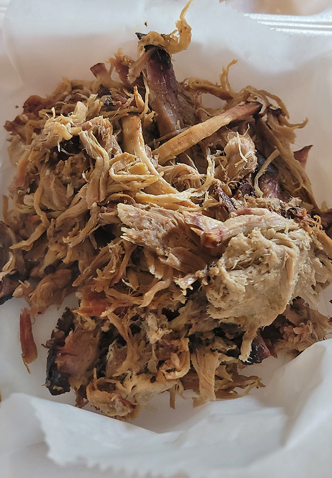 Pulled pork perfection—where strands of smoky goodness intertwine like the plot of a Tennessee Williams play, but with a happier ending.