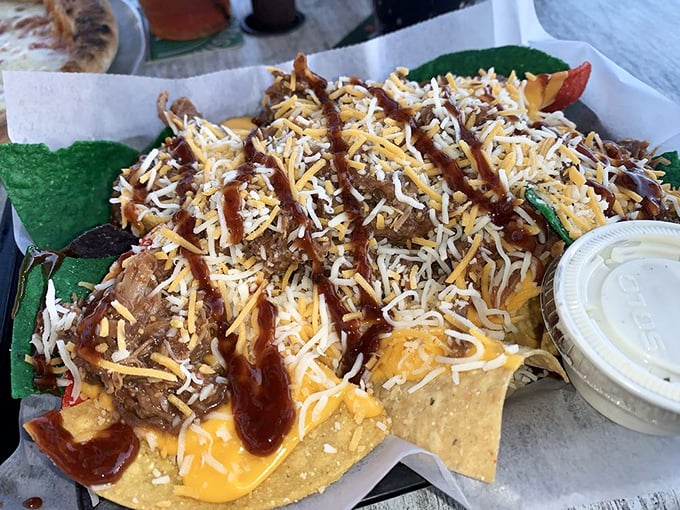 These pulled pork nachos aren't messing around—they're the kind of serious comfort food that makes you consider canceling your afternoon plans for a nap.