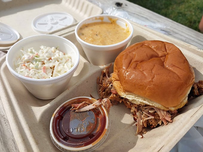 Pulled pork so tender it surrenders willingly, paired with sides that know their supporting role perfectly.