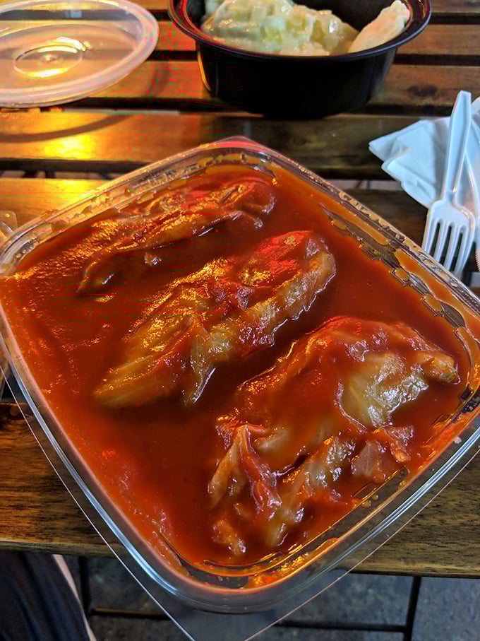 This isn't just soup, it's liquid ruby—traditional borscht with tender cabbage rolls that would make any babcia proud.