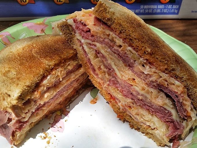 The Reuben – where corned beef, sauerkraut, and melted cheese perform a harmonious dance between two perfectly toasted slices of rye bread.