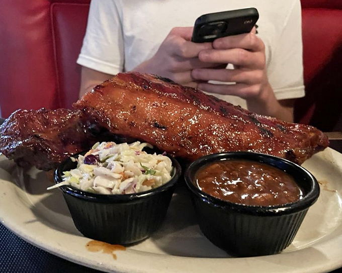 These ribs don't just fall off the bone – they practically leap into your mouth, bringing coleslaw and beans along for the flavor party.