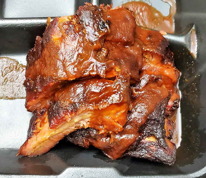 These ribs have clearly been introduced to smoke and time in all the right ways—the bark alone tells stories of patience rewarded.