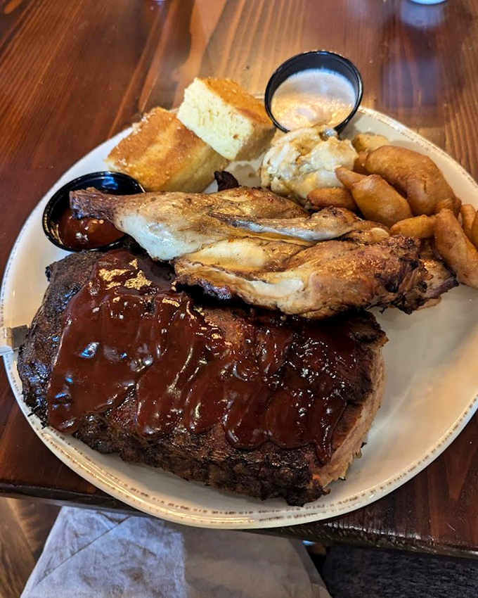 Ribs and chicken sharing a plate like old friends at a reunion. The sauce doesn't hide the meat—it celebrates it with a glossy, sticky embrace.