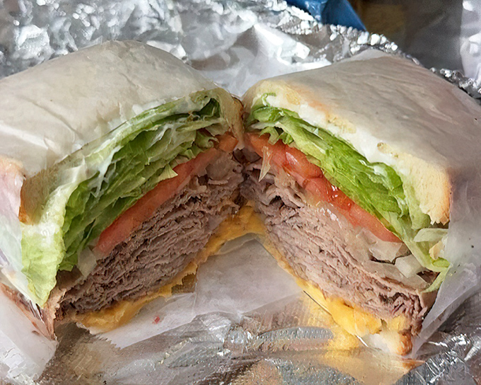 This isn't just a sandwich—it's a meditation on beef. Layers of thinly-sliced perfection nestled between bread that knows its supporting role.
