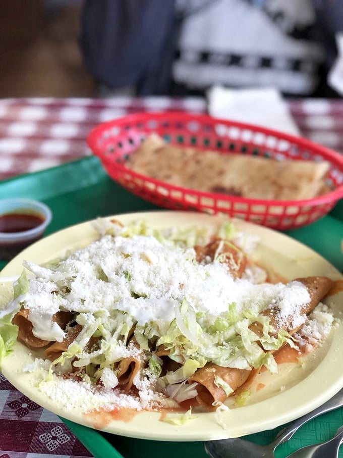 These rolled tacos aren't just topped with lettuce and cheese—they're crowned with them. Crispy, crunchy perfection that makes fast-food versions weep with inadequacy.