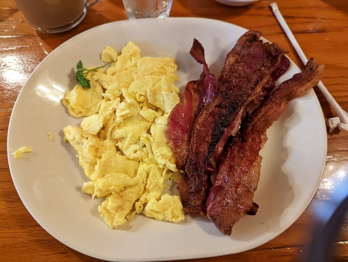 Scrambled eggs and bacon—the breakfast equivalent of a perfect high-five. Simple, reliable, and exactly what you need to start the day right.