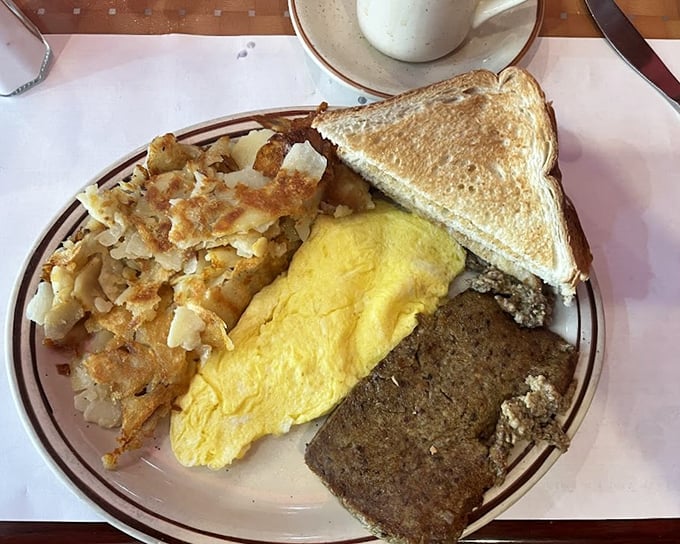 The holy trinity of diner breakfast: crispy home fries, fluffy eggs, and scrapple – Delaware's contribution to breakfast that's worth crossing state lines for.