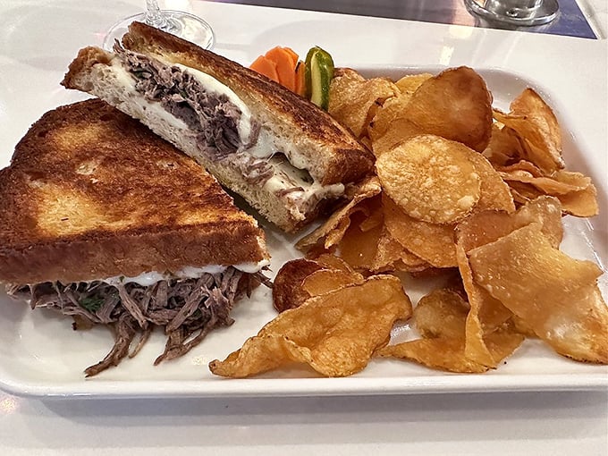 The short rib grilled cheese reveals its glorious cross-section—tender meat and melty cheese between perfectly golden bread. This isn't comfort food; it's a comfort revolution.