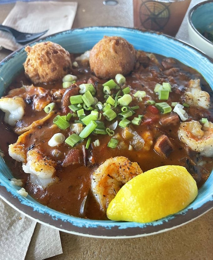 Shrimp and grits that would make a Southerner weep with joy. Those hush puppies floating atop the savory stew are the life rafts you'll gladly cling to.