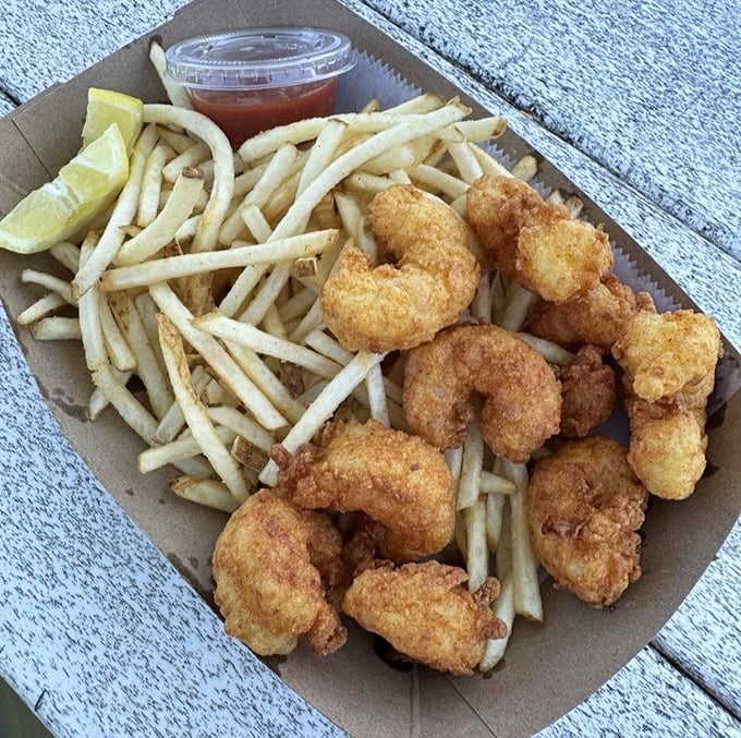 Golden-fried shrimp nestled among hand-cut fries—a basket of happiness that makes you wonder why you'd ever eat anything else.