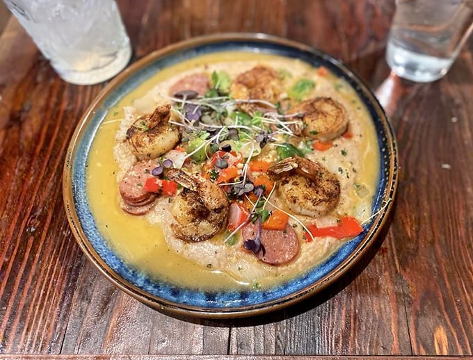 This isn't just shrimp and grits—it's a Southern hug in a bowl. Plump shrimp swimming in velvety sauce with colorful vegetables create a dish worth crossing state lines for.