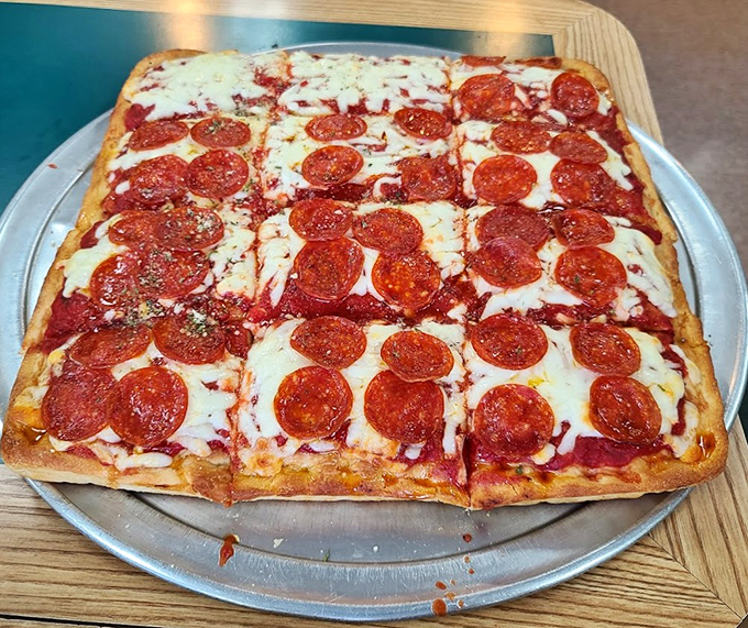 Sicilian pizza that's unapologetically square in a round world – each pepperoni placed with the precision of an Italian watchmaker.