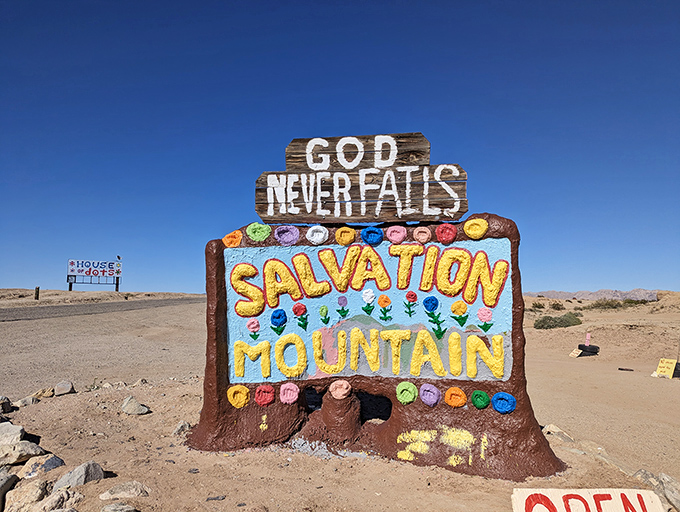 "GOD NEVER FAILS" announces the entrance sign, adorned with cheerful pastel dots that look like they escaped from a 1960s art project.