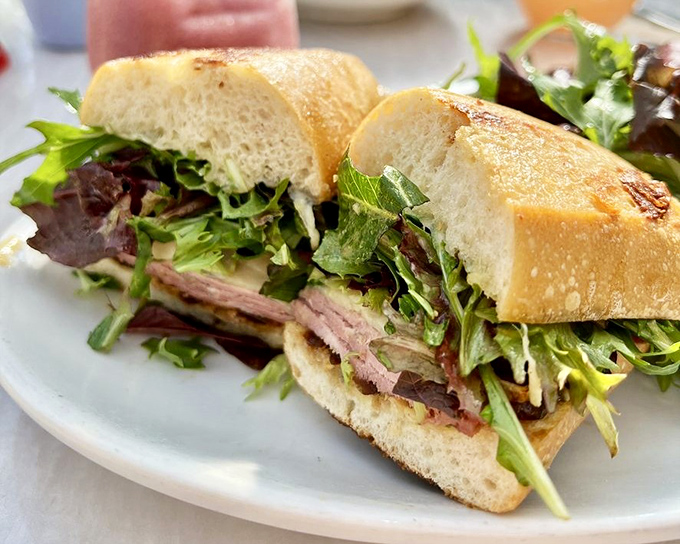This isn't just a sandwich; it's architecture. Layers of flavor between perfectly toasted bread—a skyscraper of deliciousness.