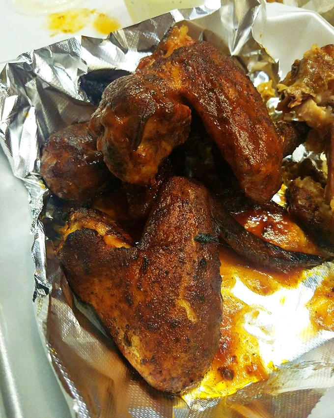 These wings aren't just smoked—they've been transformed into crispy-skinned flavor bombs that make ordinary buffalo wings seem like child's play.
