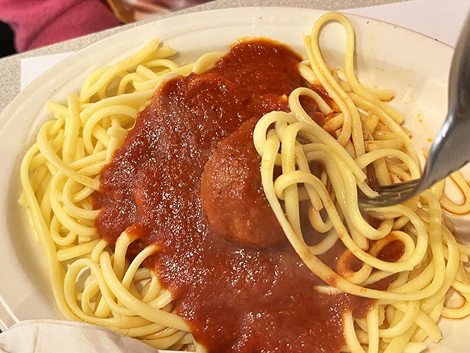 Spaghetti that makes you understand why Lady and the Tramp risked public embarrassment. That sauce isn't just red—it's a sunset in Tuscany.