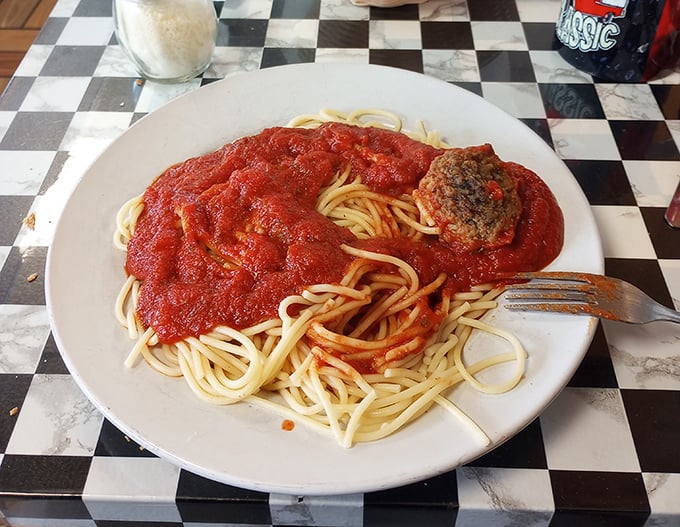 Spaghetti and meatball simplicity at its finest – the kind of red sauce that would make an Italian grandmother nod in silent approval.