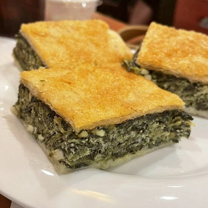 The spanakopita squares are architectural marvels of flaky phyllo and spinach—proof that the Greeks knew what they were doing thousands of years ago.
