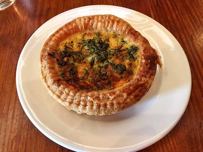 This isn't just quiche—it's a masterclass in custard architecture with a crust so buttery it should require a warning label.
