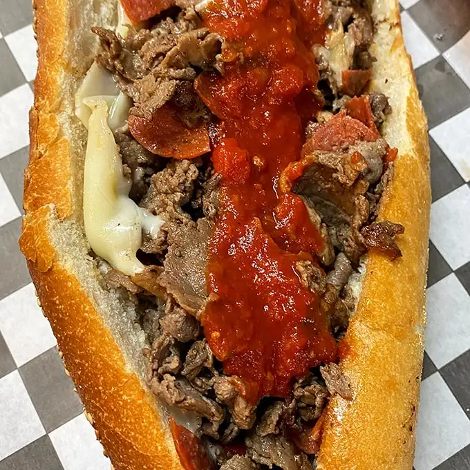 When marinara meets cheesesteak, magic happens. The sauce adds a tangy counterpoint to the rich meat and melted cheese symphony.