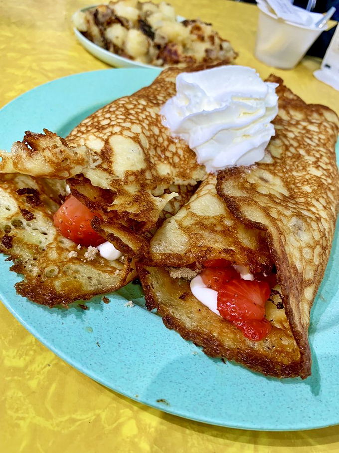 These strawberry hotcakes don't just satisfy hunger—they create memories. The crispy edges fold over fresh berries like they're giving them a warm hug.