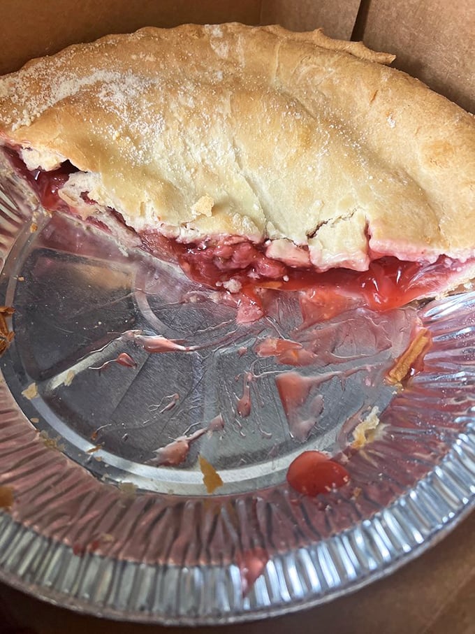 Ruby-red strawberry filling peeking through golden crust—like nature and craftsmanship had a delicious collaboration.