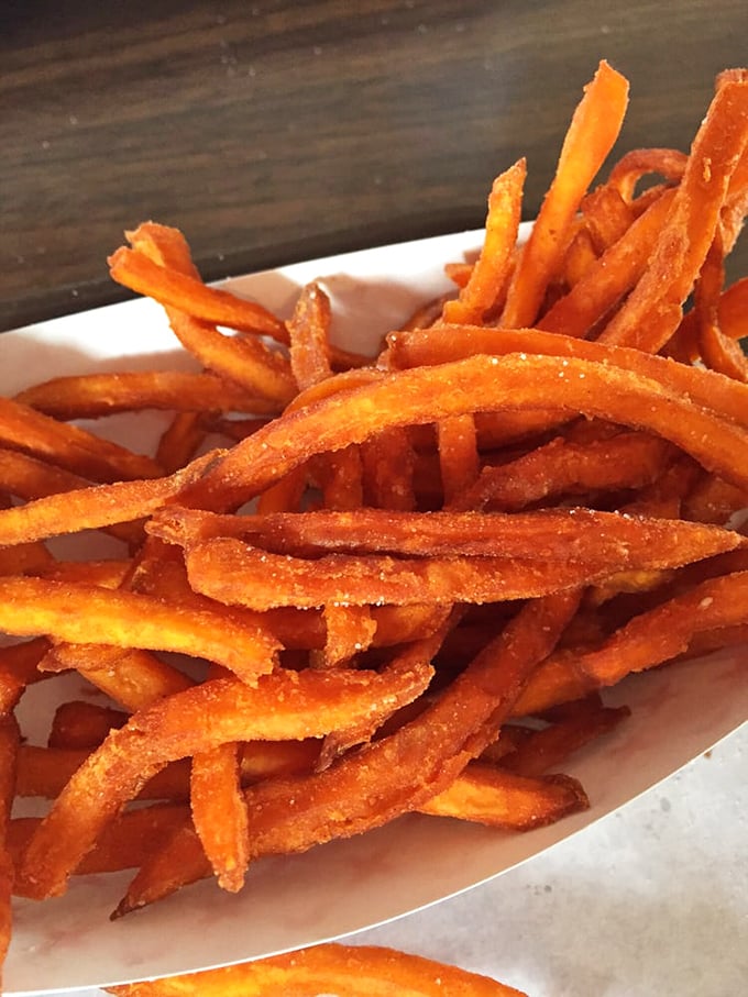 Sweet potato fries that manage to be both crispy and tender—a culinary magic trick that deserves standing ovation and extra dipping sauce.