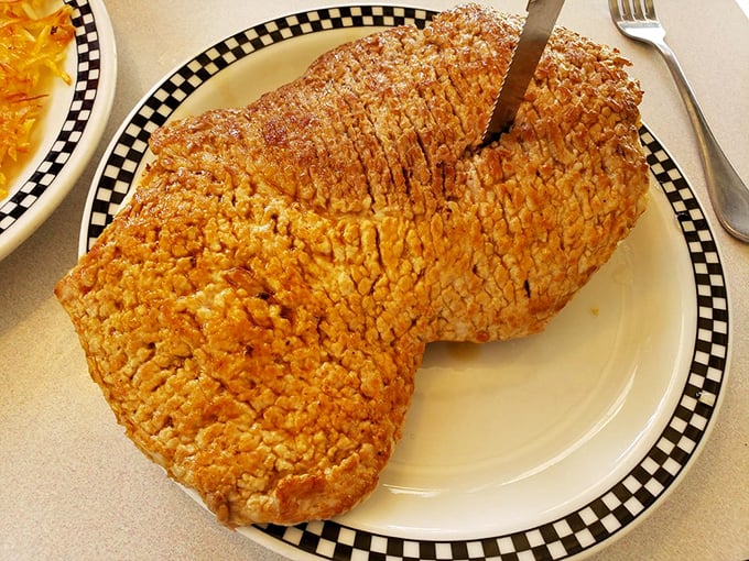 This isn't just a tenderloin—it's a crispy, golden monument to Hoosier excess that requires its own zip code and possibly building permit.