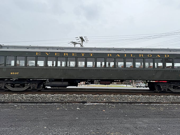 The elegant passenger car bears the Everett Railroad name in gold lettering—a rolling museum piece that still earns its keep.