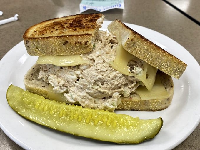 The tuna melt at Slyman's proves that even their "lighter" options require two hands and a strategy session. That pickle isn't garnish—it's moral support.