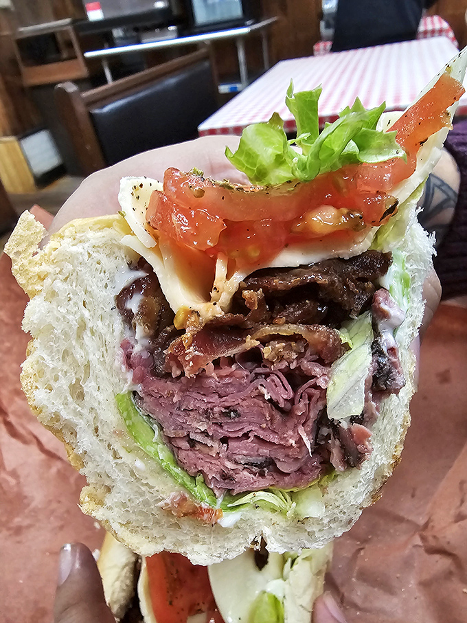 Layer upon glorious layer – this cross-section reveals the architectural marvel that is a proper deli sandwich. Skyscrapers wish they were this well-constructed.