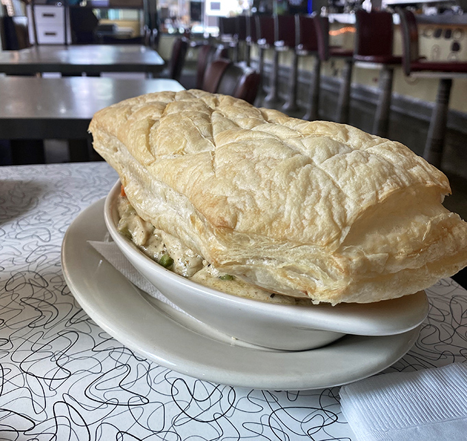 This pot pie doesn't just break through its pastry ceiling—it shatters your expectations of what diner food can be.