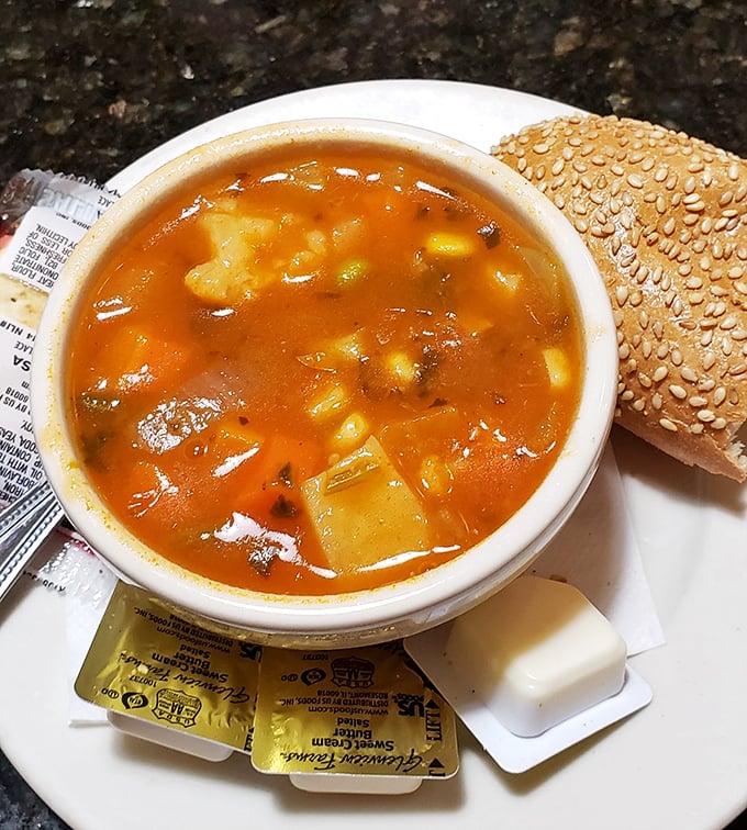 A vegetable soup that actually contains recognizable vegetables—revolutionary concept! Served with a sesame-studded sidekick for proper dunking.