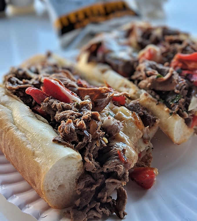 The kind of cheesesteak that makes you forget your name mid-bite. Those caramelized peppers and that glistening beef are performing a culinary symphony.