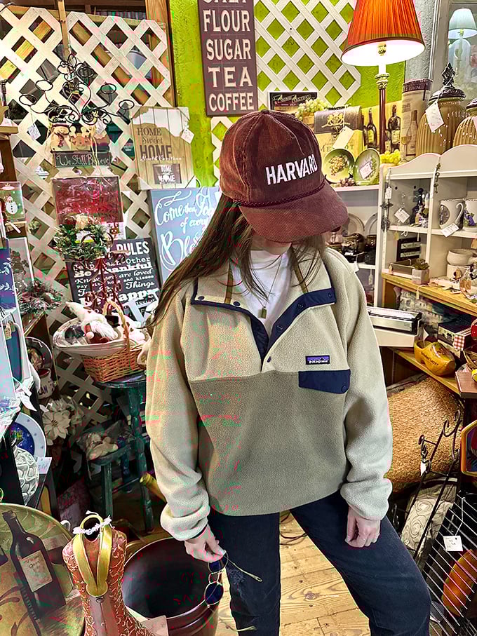Fashion finds aren't just affordable—they're statement pieces. That Patagonia fleece and Harvard cap combo? Pure thrift store gold.