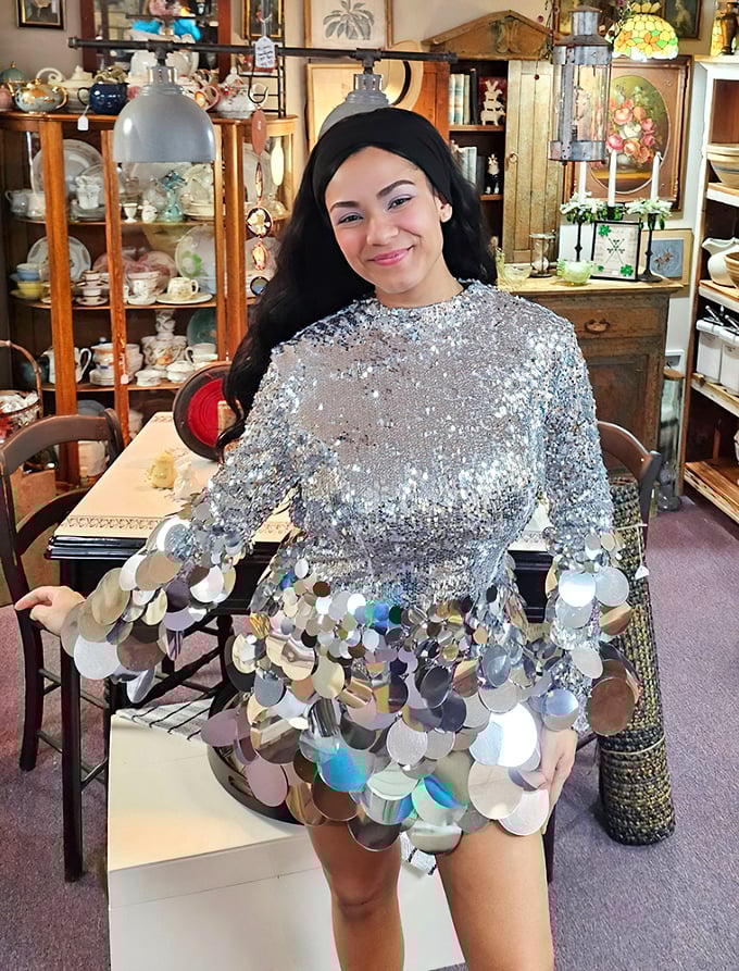 The antique shop backdrop transforms even modern fashion into something magical—like finding the perfect vintage frame for a new photograph.