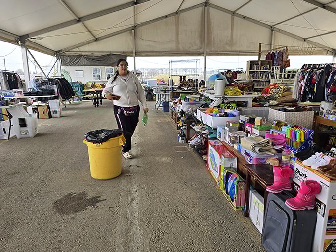 The weekend treasure hunt begins! Colorful merchandise lines both sides of this covered walkway, with shoppers scanning for their next great find.
