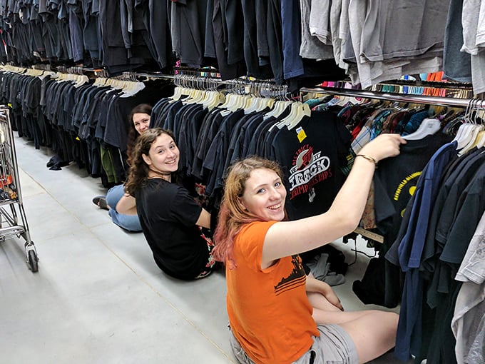 The true thrift store experts know the secret—get down to floor level where the hidden gems often lurk between the hangers.