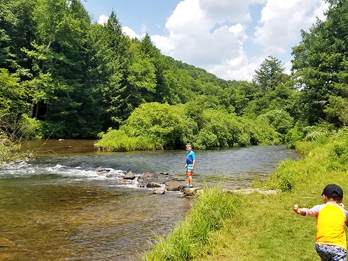 Kids discovering the simple joy of splashing in the river – childhood as it should be, unplugged and wonderfully wet.