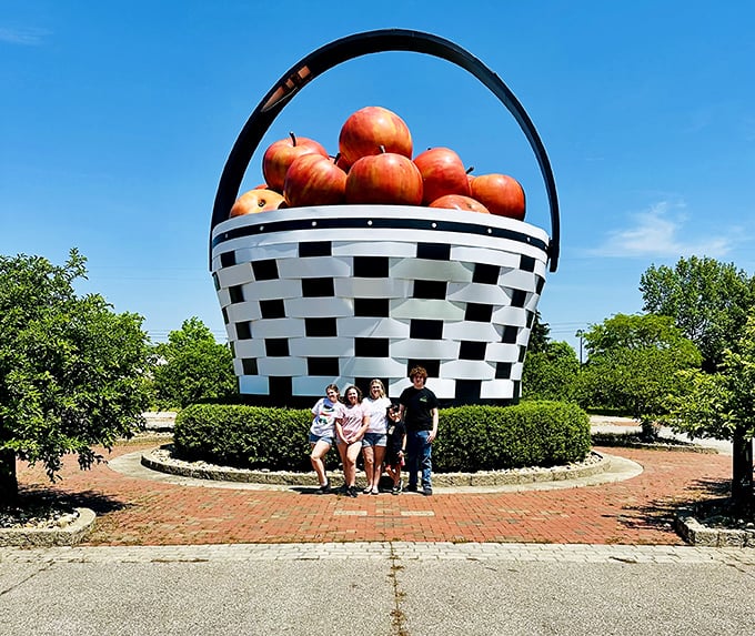 Size matters! The basket provides the perfect backdrop for family photos, instantly turning ordinary tourists into characters in a delightful tale of agricultural gigantism.