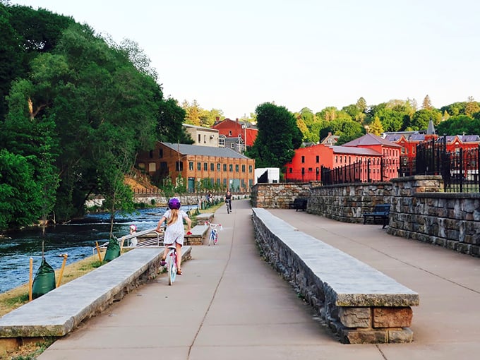 The waterfront walkway invites leisurely strolls where the biggest decision is which bench to claim for people-watching.