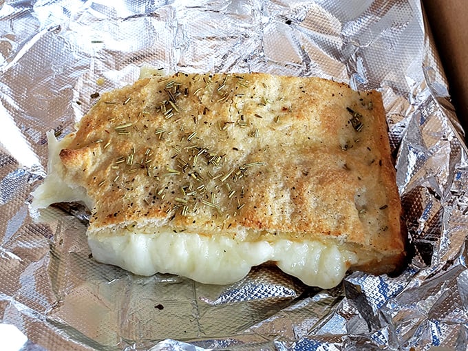 Old Forge white pizza isn't just a meal, it's an experience. That melty cheese and herb-flecked crust would make even a New Yorker question their pizza loyalty.