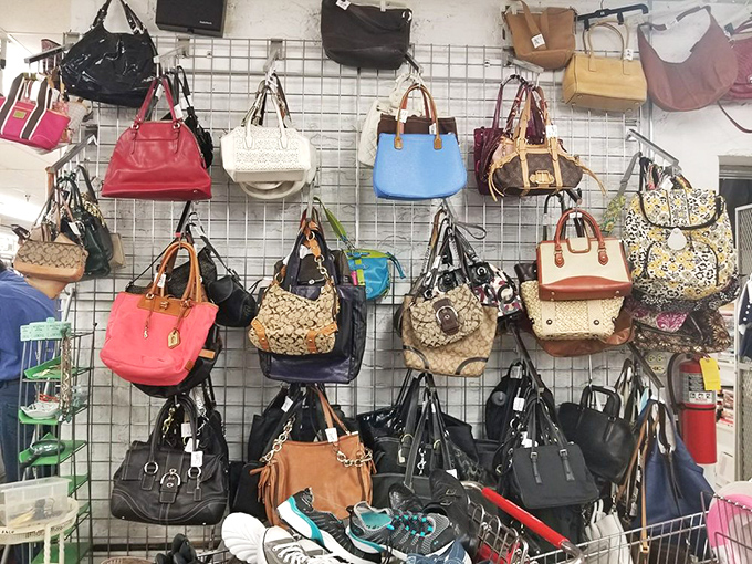 Handbag heaven! Designer dreams and practical carryalls hang in suspended animation, waiting for their second chance at accessorizing greatness.