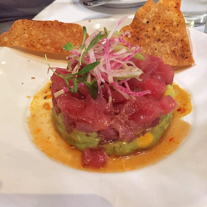 This tuna poke is architecture on a plate – ruby-red fish perched atop creamy avocado, a tower of flavor waiting to topple deliciously.