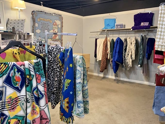 Colorful scarves and textiles hang like abstract art, each piece waiting to add character to someone's wardrobe or living space.