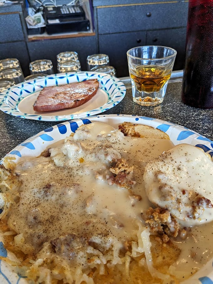 Biscuits and gravy with a side of ham – the kind of breakfast that makes you want to cancel your plans and declare today a personal holiday.