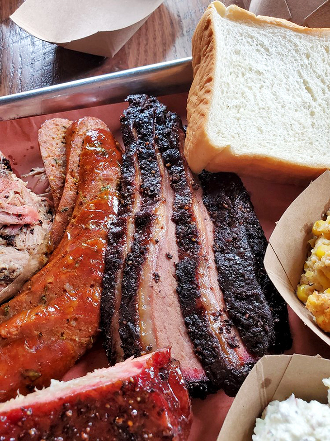 The barbecue board of your dreams. That pink smoke ring isn't makeup—it's a badge of honor earned through patience.