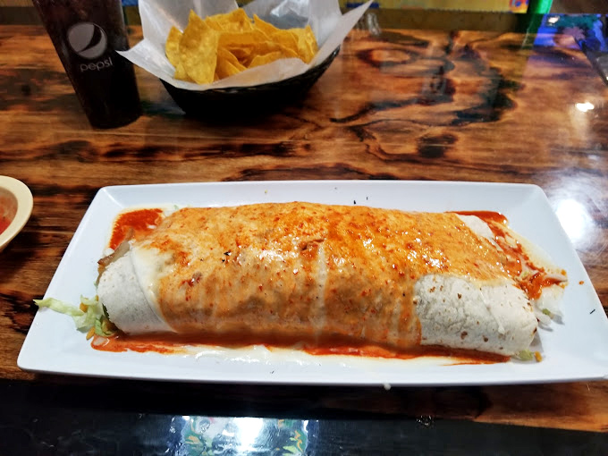 This isn't just a burrito—it's a tortilla sleeping bag stuffed with dreams and wrapped in a sauce blanket that whispers, "Take a siesta after."